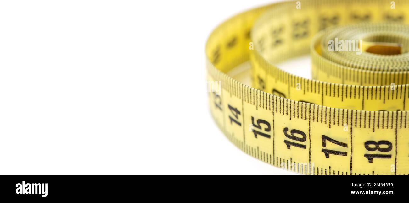Yellow measuring tape isolated on white background Stock Photo - Alamy