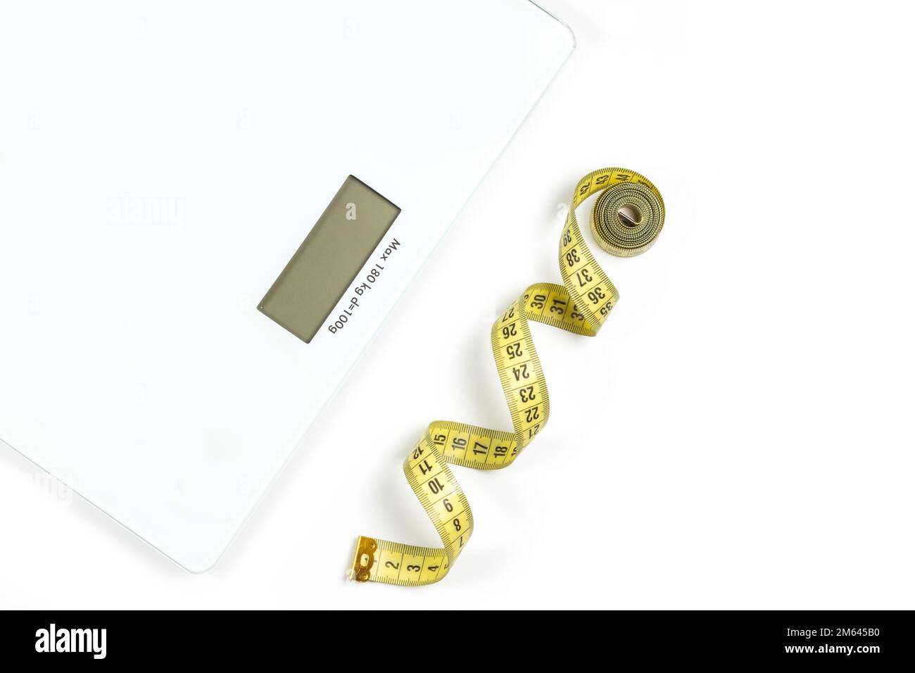 Modern scales and tape measure isolated on white, top view Stock Photo ...