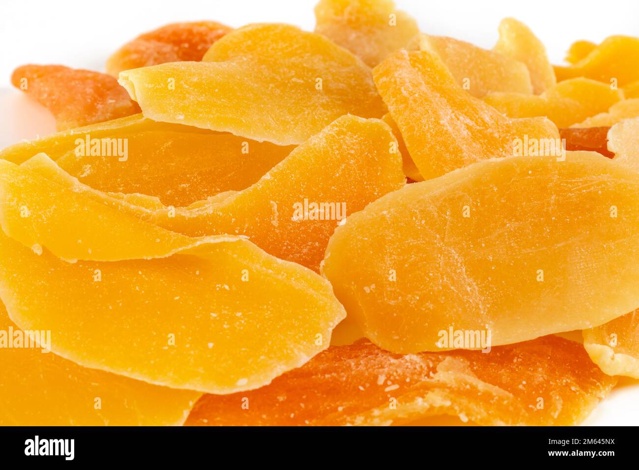 Natural dried organic mango and a white background Stock Photo - Alamy
