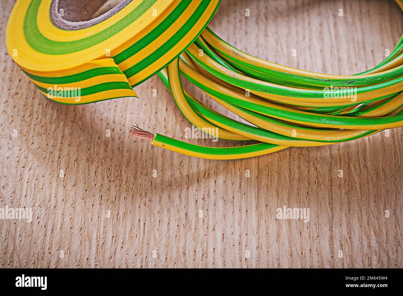 Rolled insulation tape electrical wires on wooden board electricity ...
