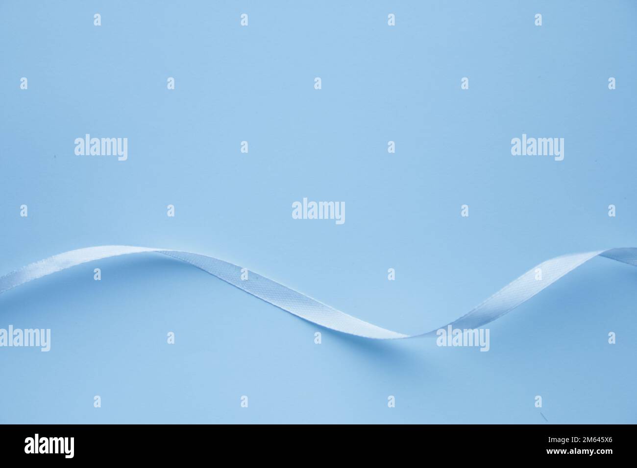 Blue ribbon on a blue background. Background for a card. Wallpaper of ...