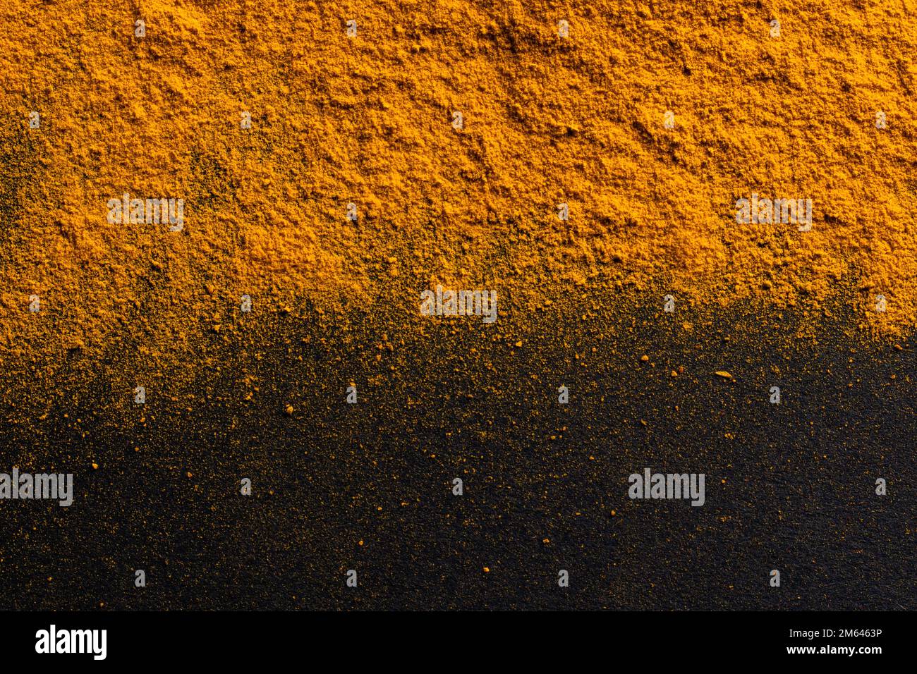 Yellow color powder explosion on black background Stock Photo - Alamy