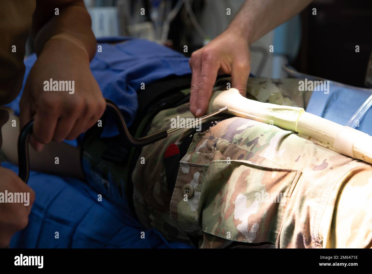 A German Surgical Team, simulates drilling for a reconstruction of a ...