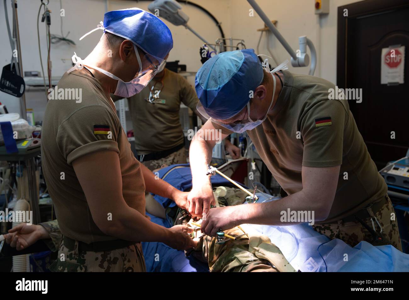 A German Surgical Team, place rods and pins during a reconstruction of ...