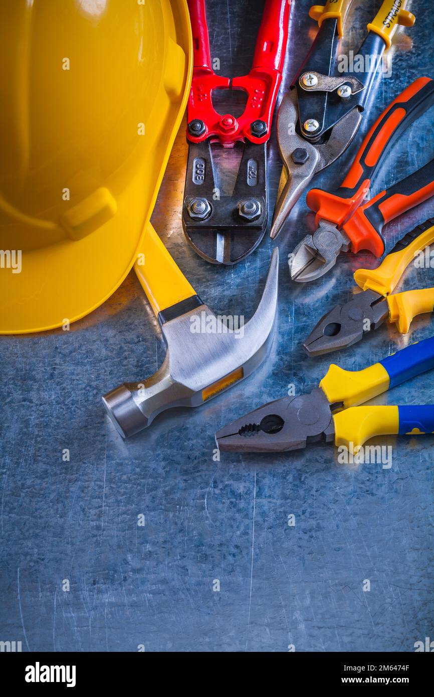 Scratched metallic background with variation of construction tools ...