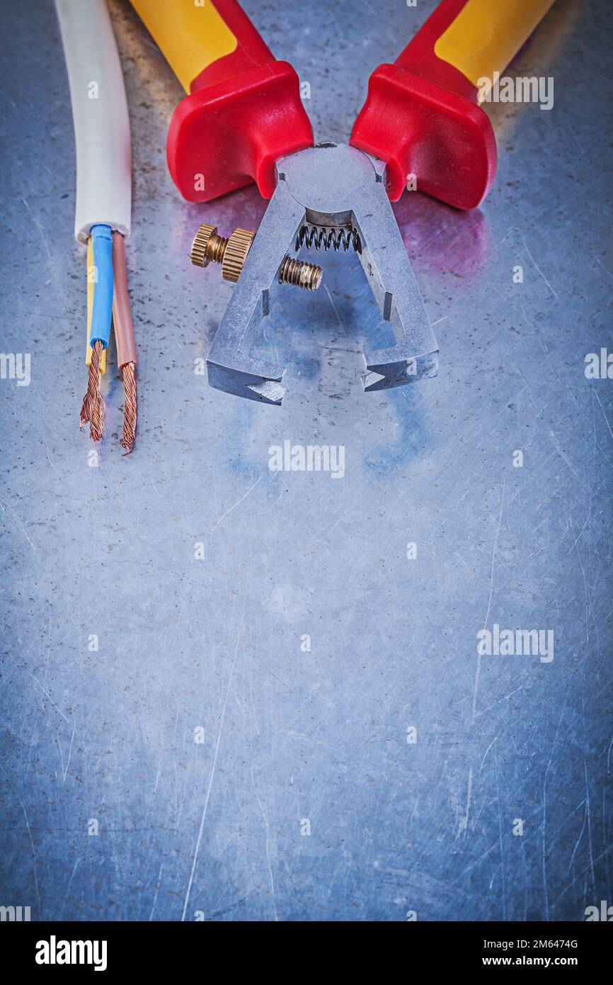 Set of insulation strippers electrical wires on metallic background ...
