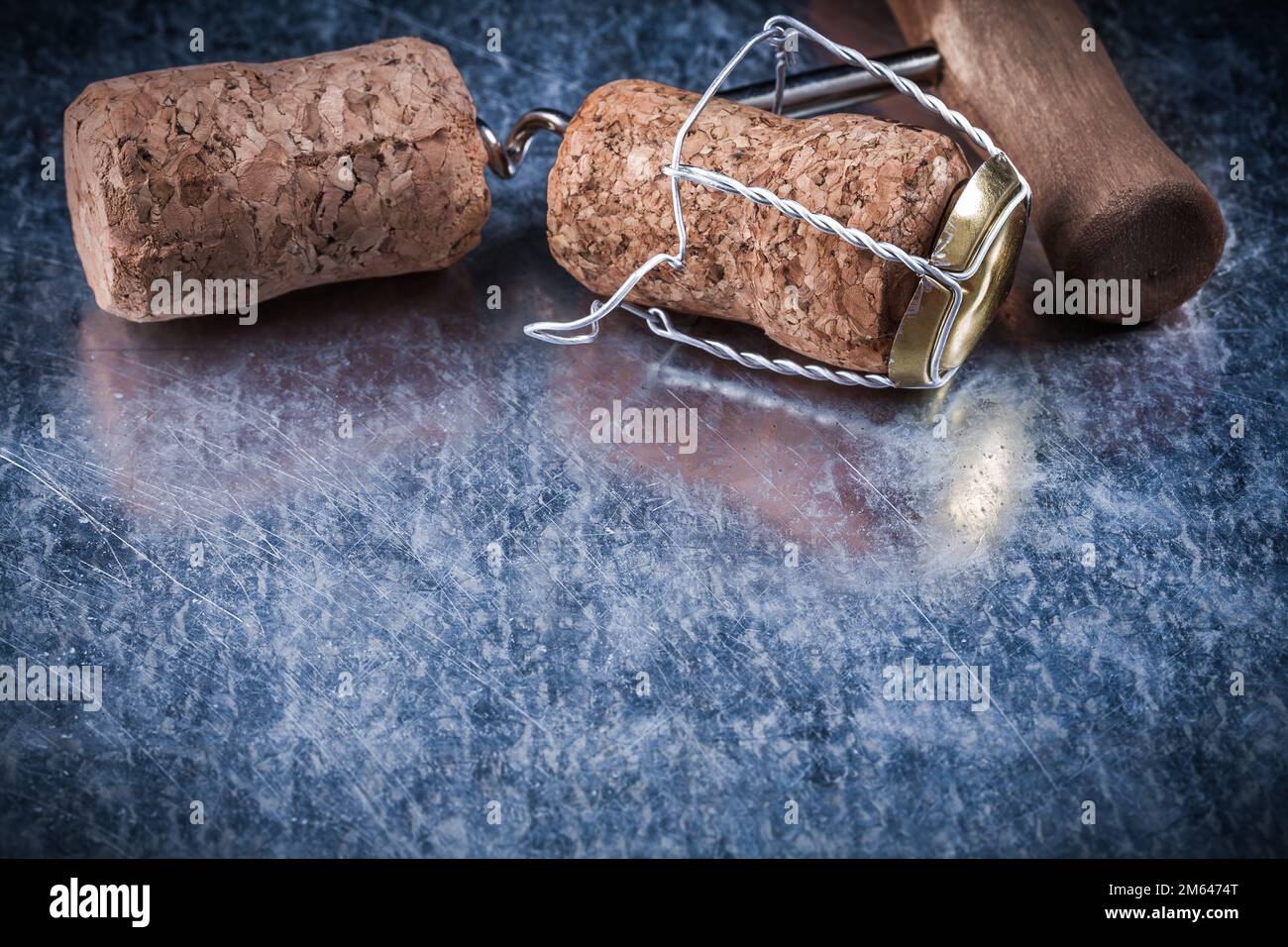 Set of champagne corks twisted wire corkscrew on metallic background ...