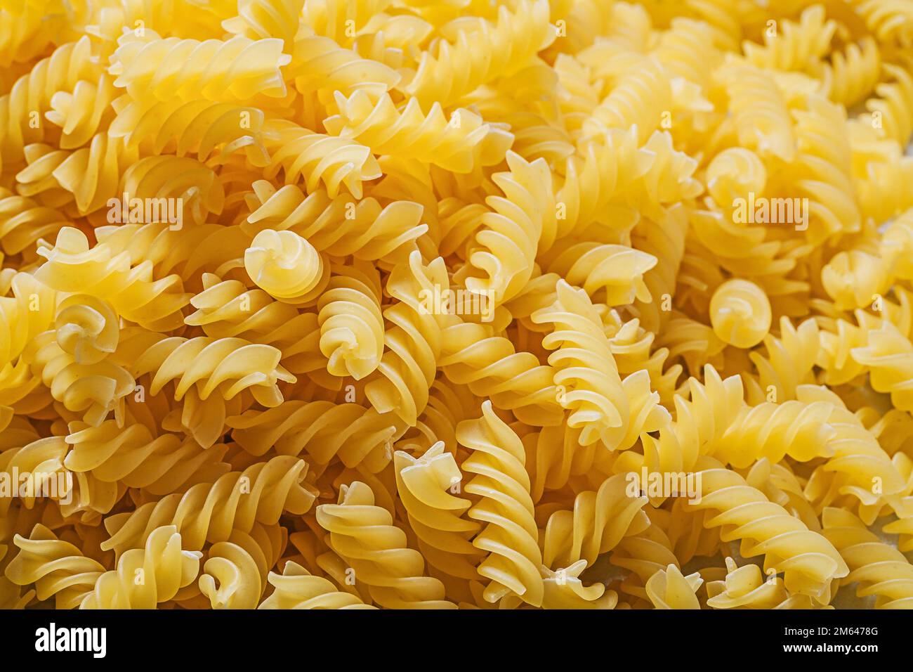 Short-cut spiral pasta backdrop food and drink concept Stock Photo - Alamy