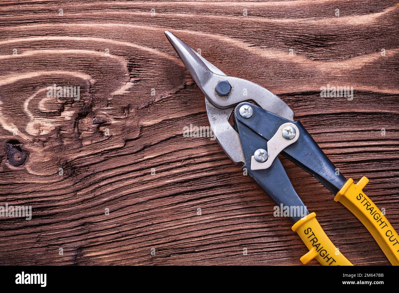 Single metal nippers on wood vintage board construction concept Stock ...