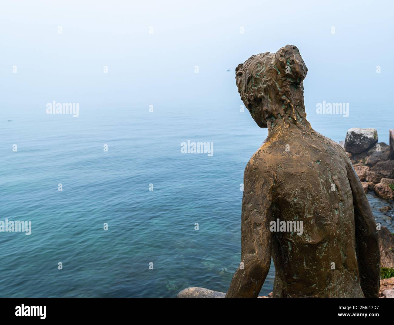 Statue of the Little Mermaid of the picturesque town of Lazise on Lake ...
