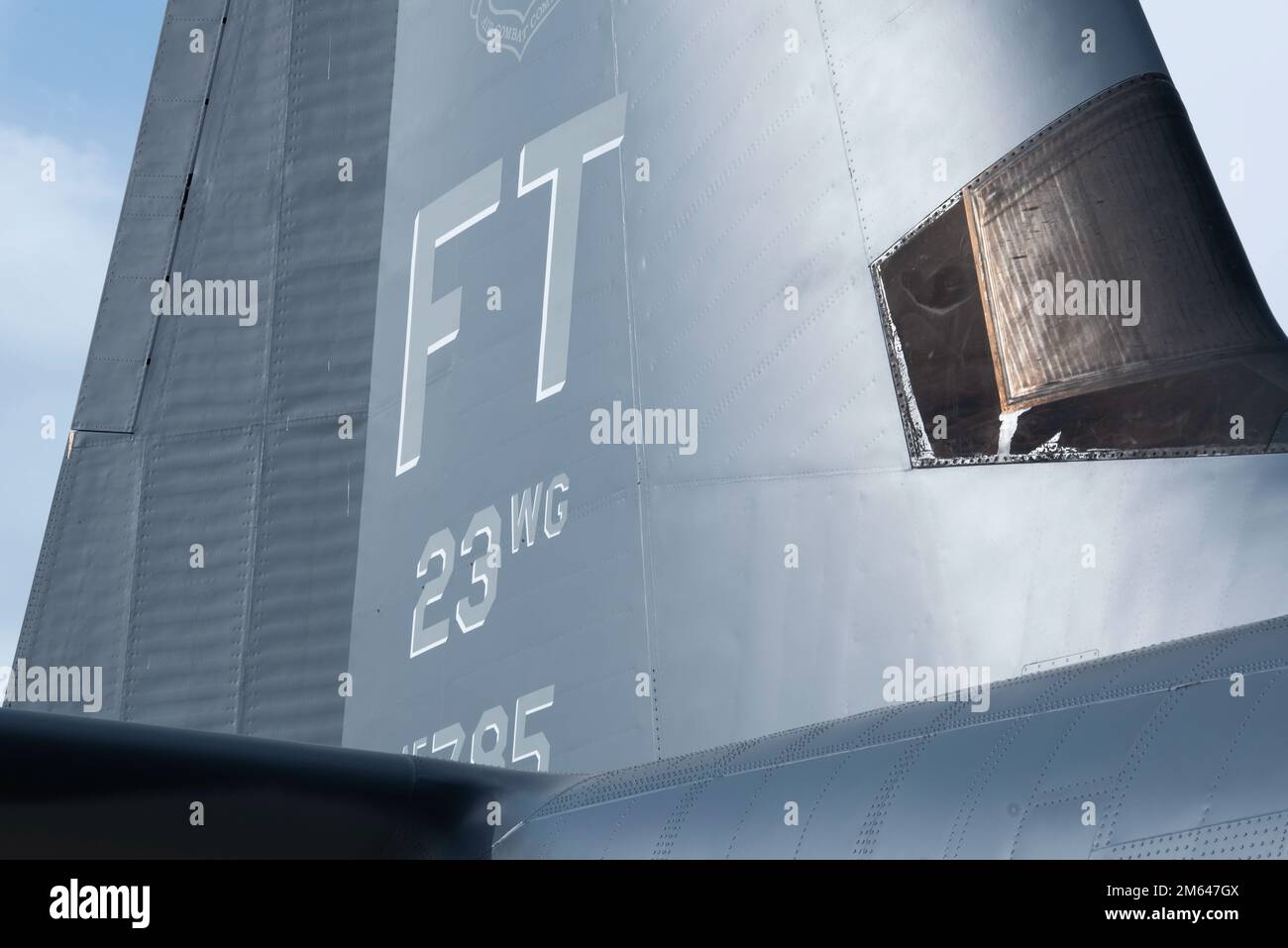 The tail of HC-130J Combat King II stands on the flightline during a ...