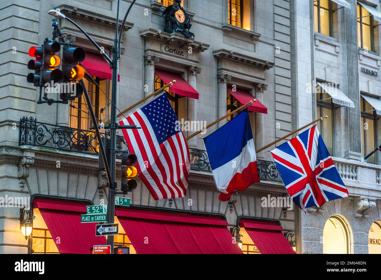 American, French and British flags on a building in the 5th avenue, New ...