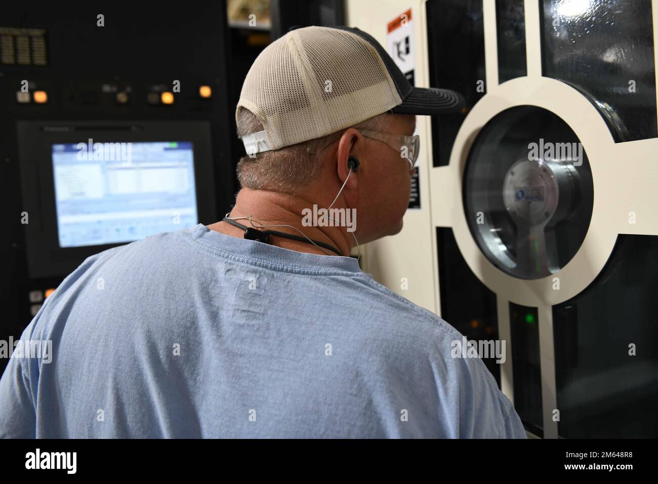 Philip Trauth, 573rd CMXS machinist, monitors a Makino T-4 5-axis ...
