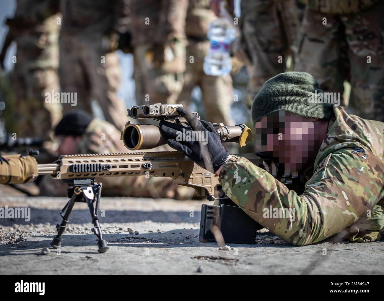 A U.S. Army Green Beret assigned to 10th Special Forces Group trains ...