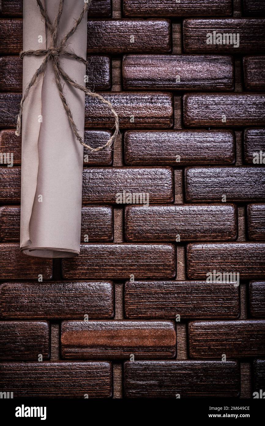 Vintage rolled paper on rowing wooden matting Stock Photo - Alamy