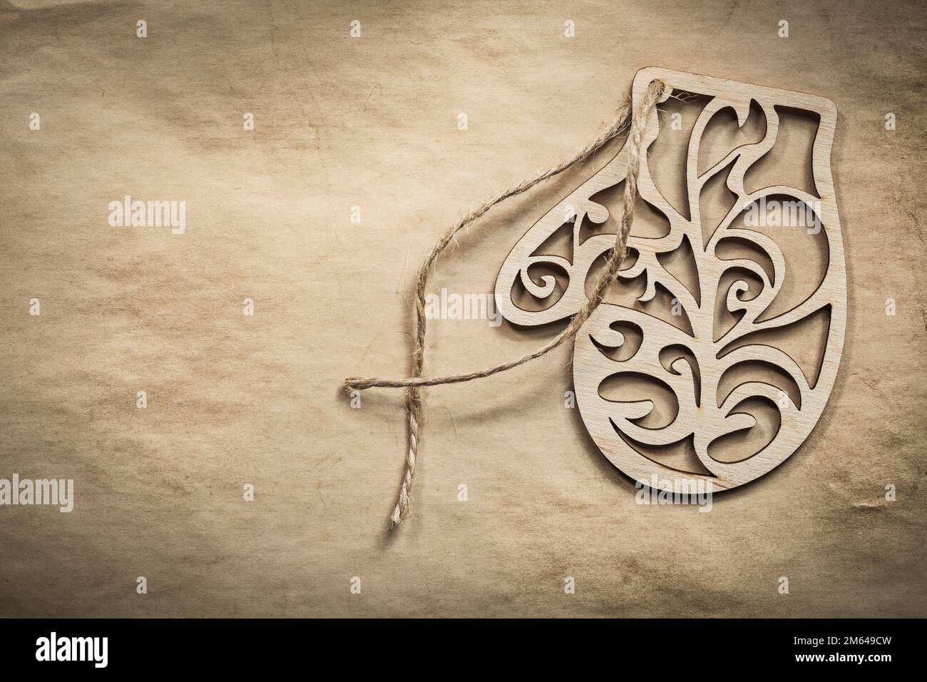 Vintage wooden mitten string on paper background holidays concept Stock ...