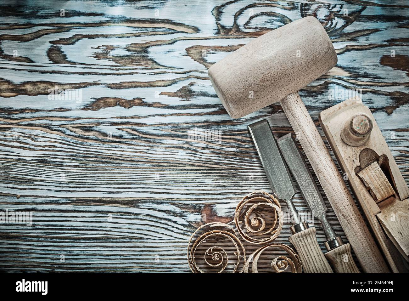 Wooden hammer chisels planer planning chips on wood board Stock Photo ...