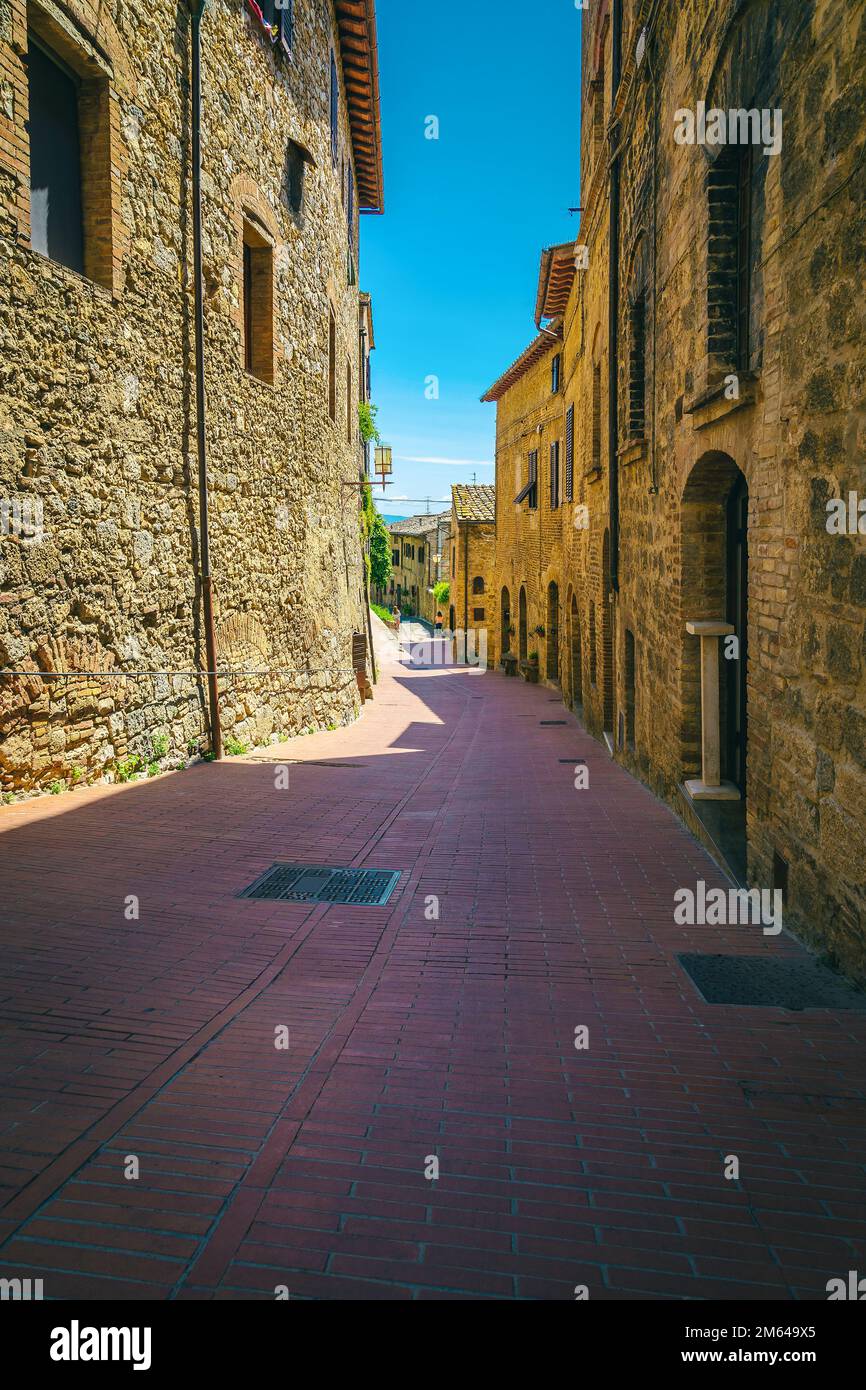 Rustic tuscan stone houses and paved pedestrian street view in San ...