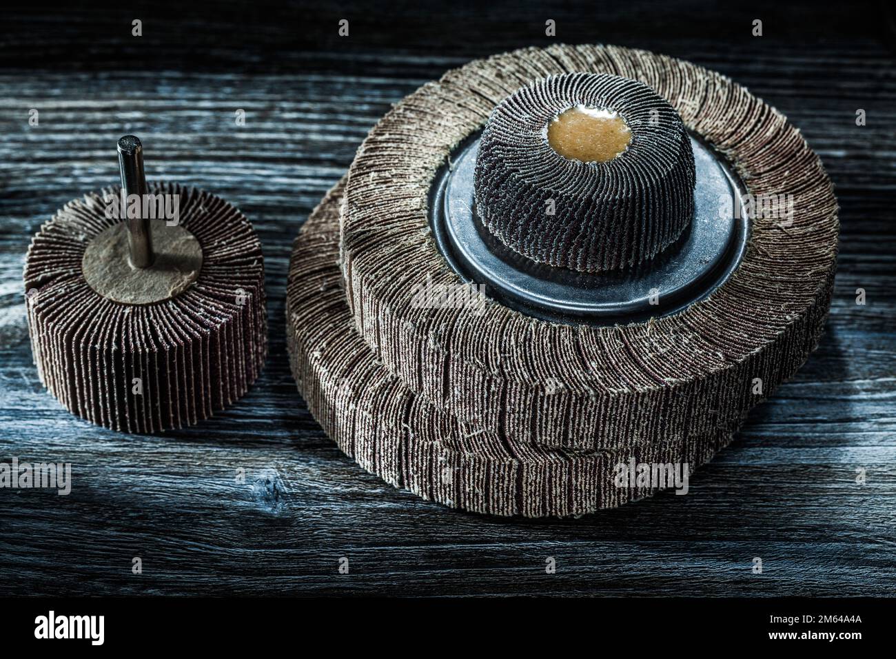 Used rotary grinding wheels on vintage wooden board Stock Photo - Alamy