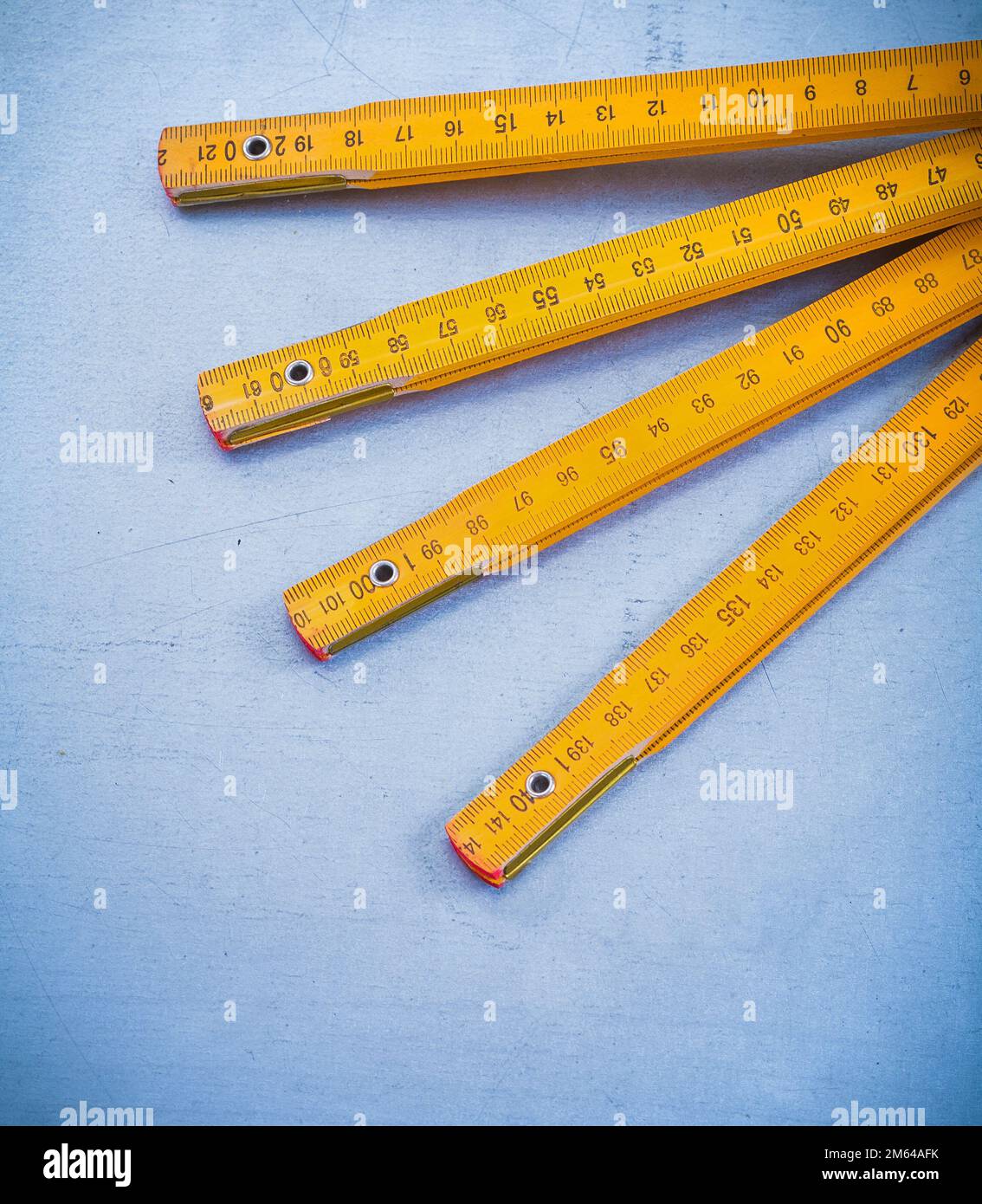 Wooden meter on metallic background construction concept Stock Photo ...