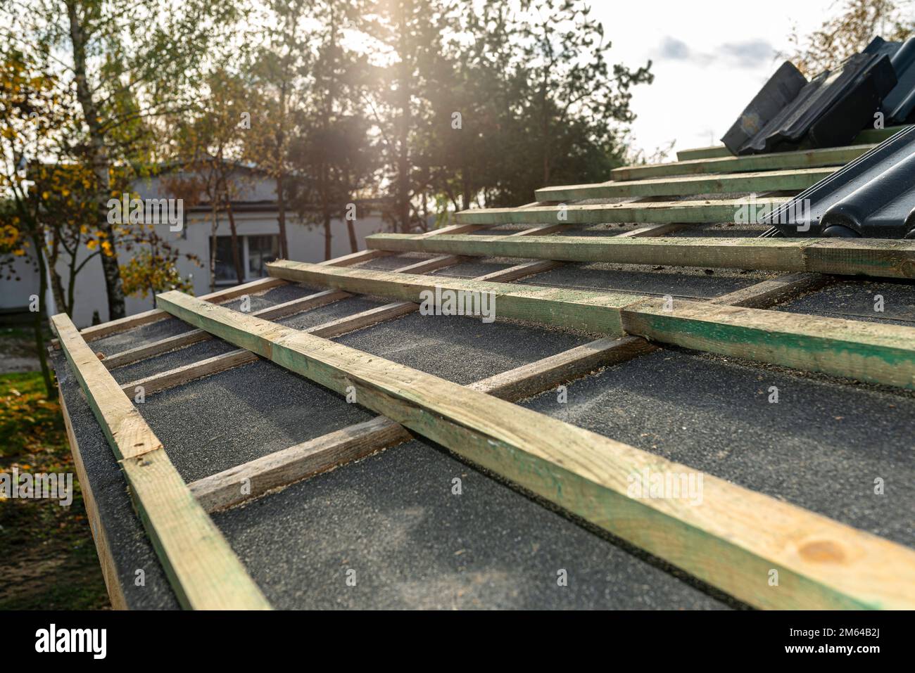 Roof ceramic tile arranged in packets on the roof on roof battens ...