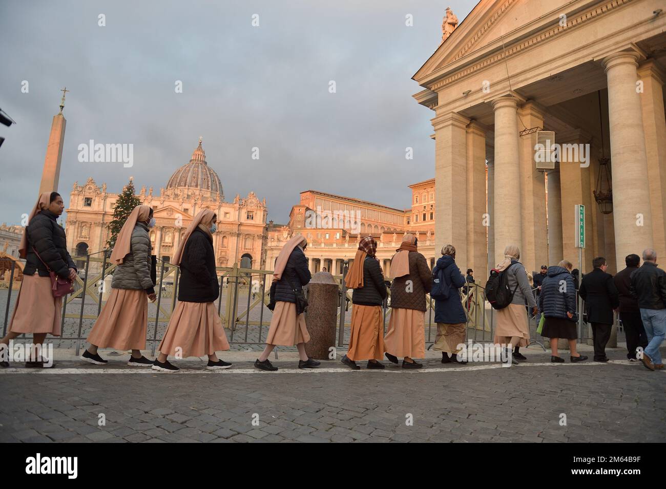 Vatican City State, . 02nd Jan, 2023. People wait in a line to enter ...