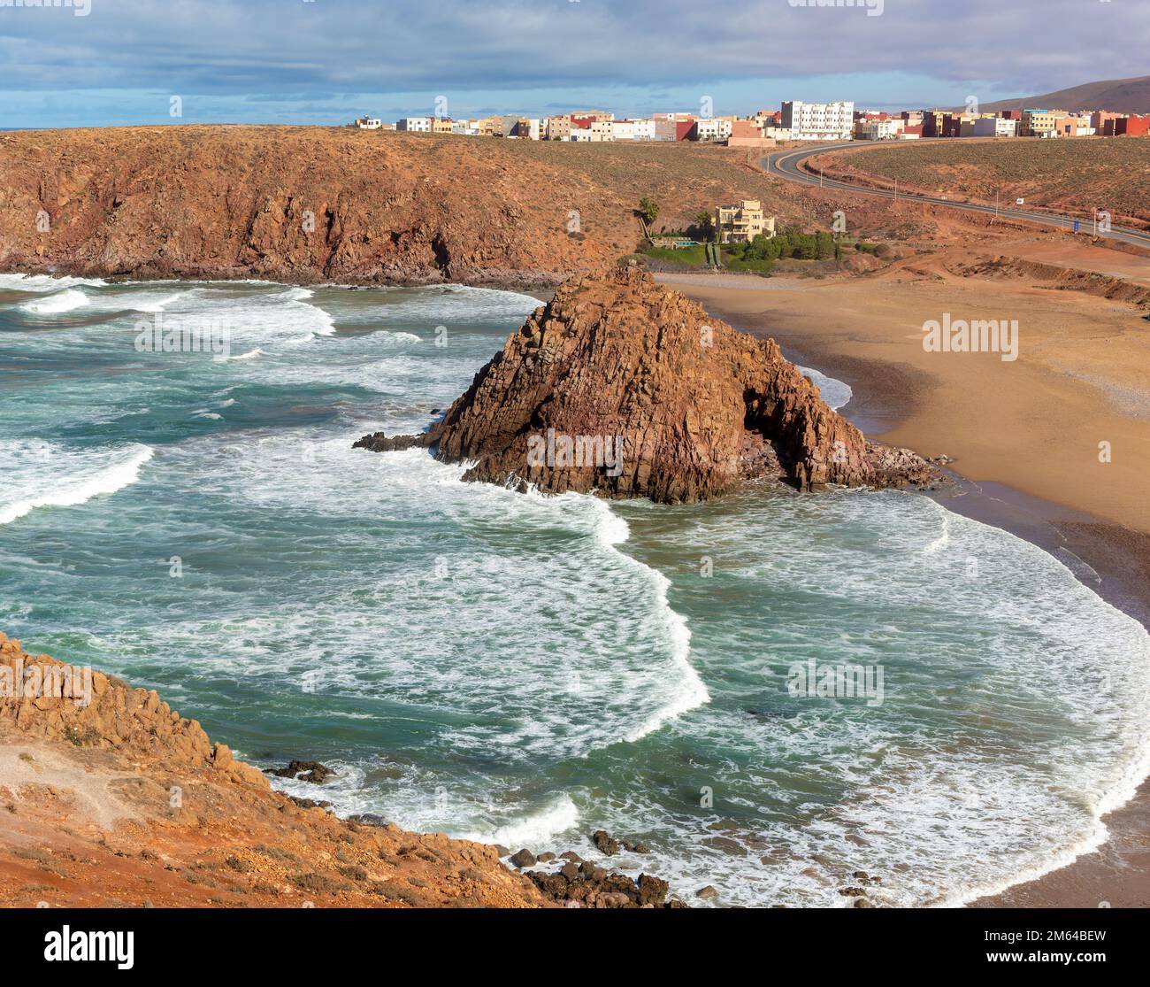 Beach rocky outrcop coastline in bay, Plage Sidi Mohammed Ben Abdellah ...