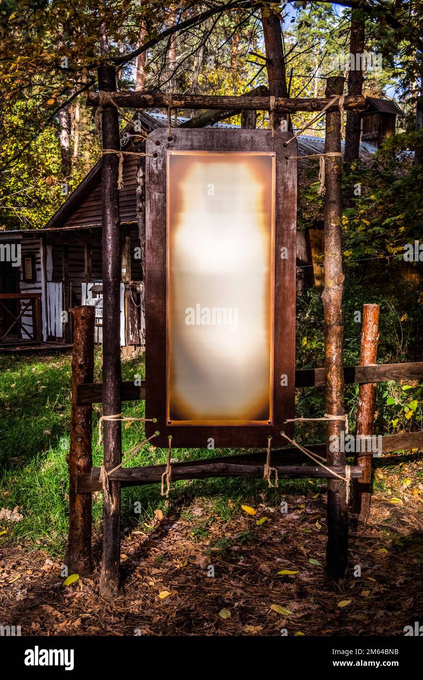 Wooden signs-pointers in a deep dark forest Stock Photo - Alamy