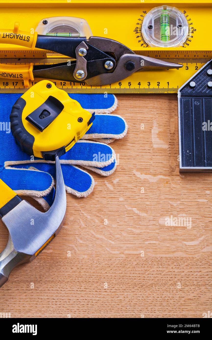 Brown wooden board with collection of construction objects maintenance ...