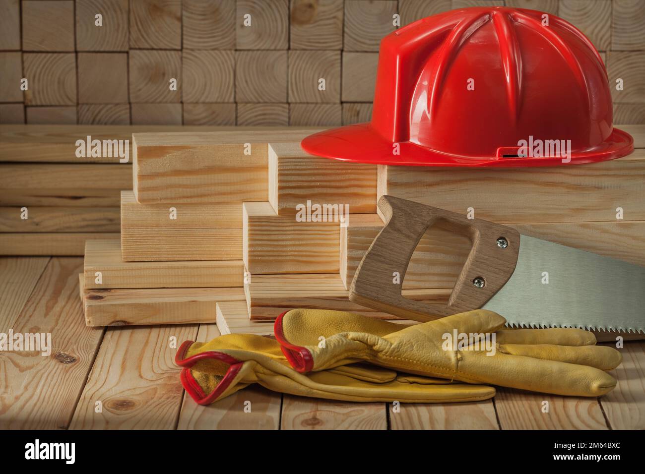 construction carpentry tools red helmet glaves and handsaw on wooden ...
