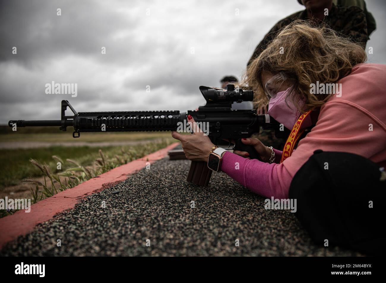 An Educator from the 12th recruiting district, fires a rifle during an ...