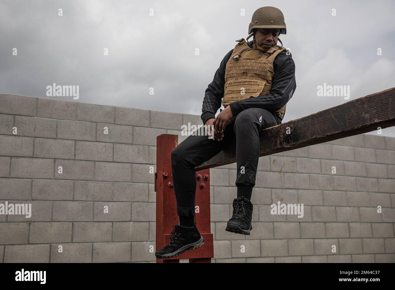 An Educator from the 12th recruiting district, sits on an obstacle ...