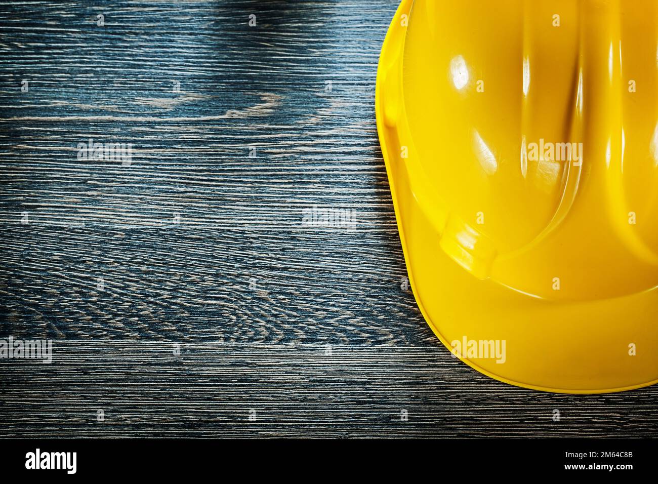 Safety building helmet on wooden board Stock Photo - Alamy