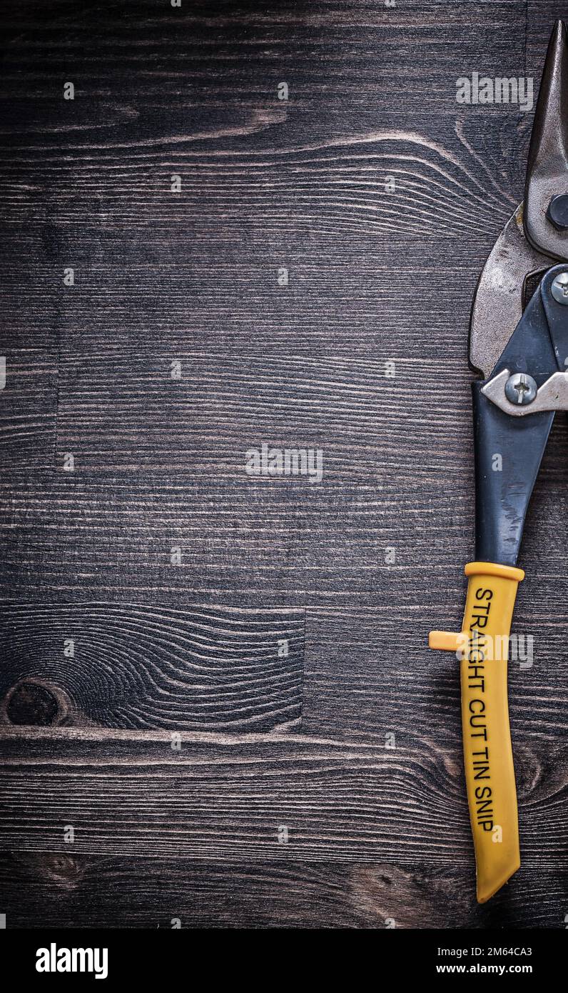 Stainless sharp wire cutter on wood board construction concept Stock ...