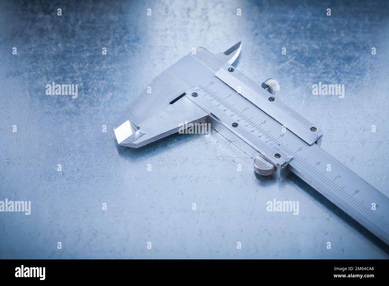 Steel trammel caliper on metallic background horizontal view ...