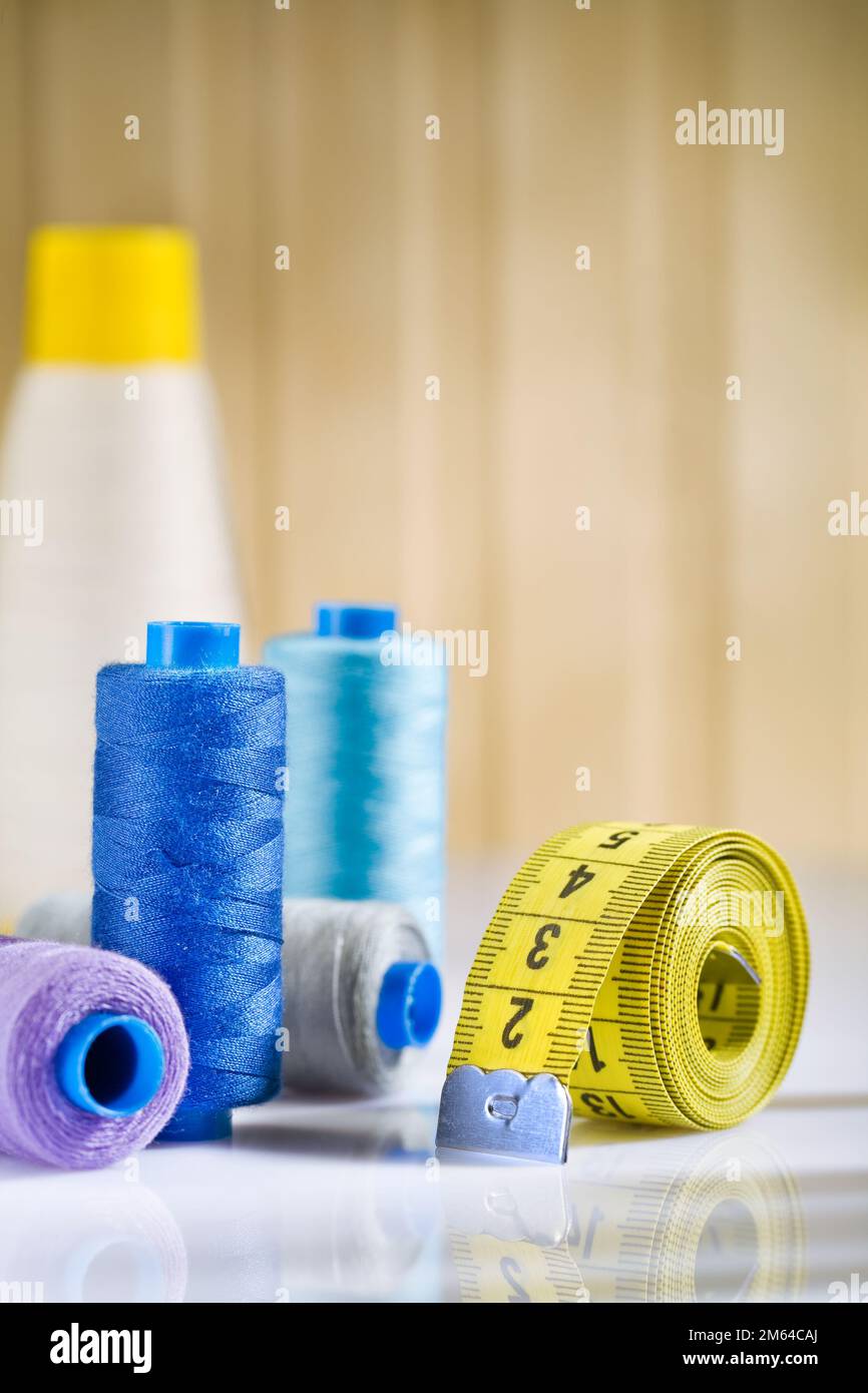 sewing spools and tapeline Stock Photo - Alamy