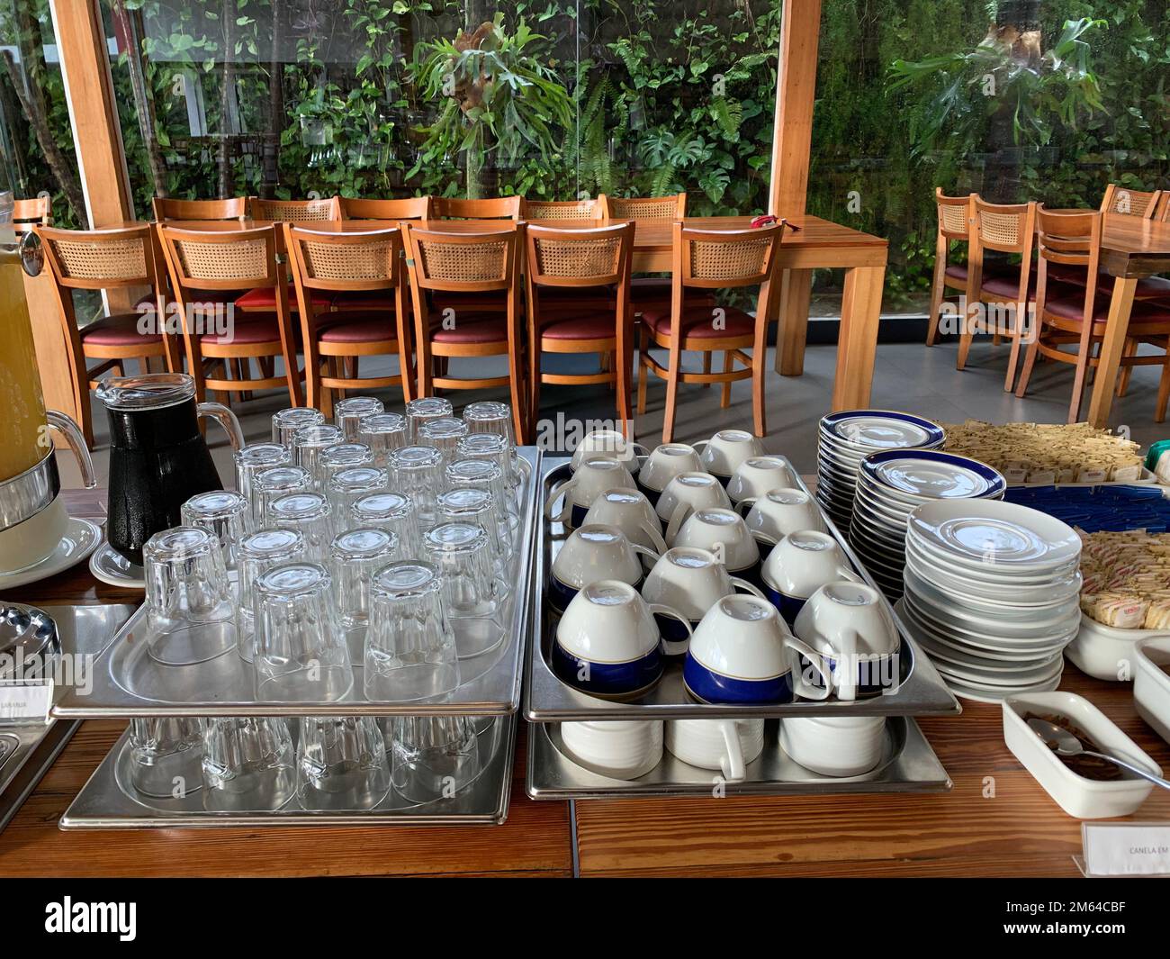 Breakfast buffet setting in a restaurant with glasses and cups Stock ...