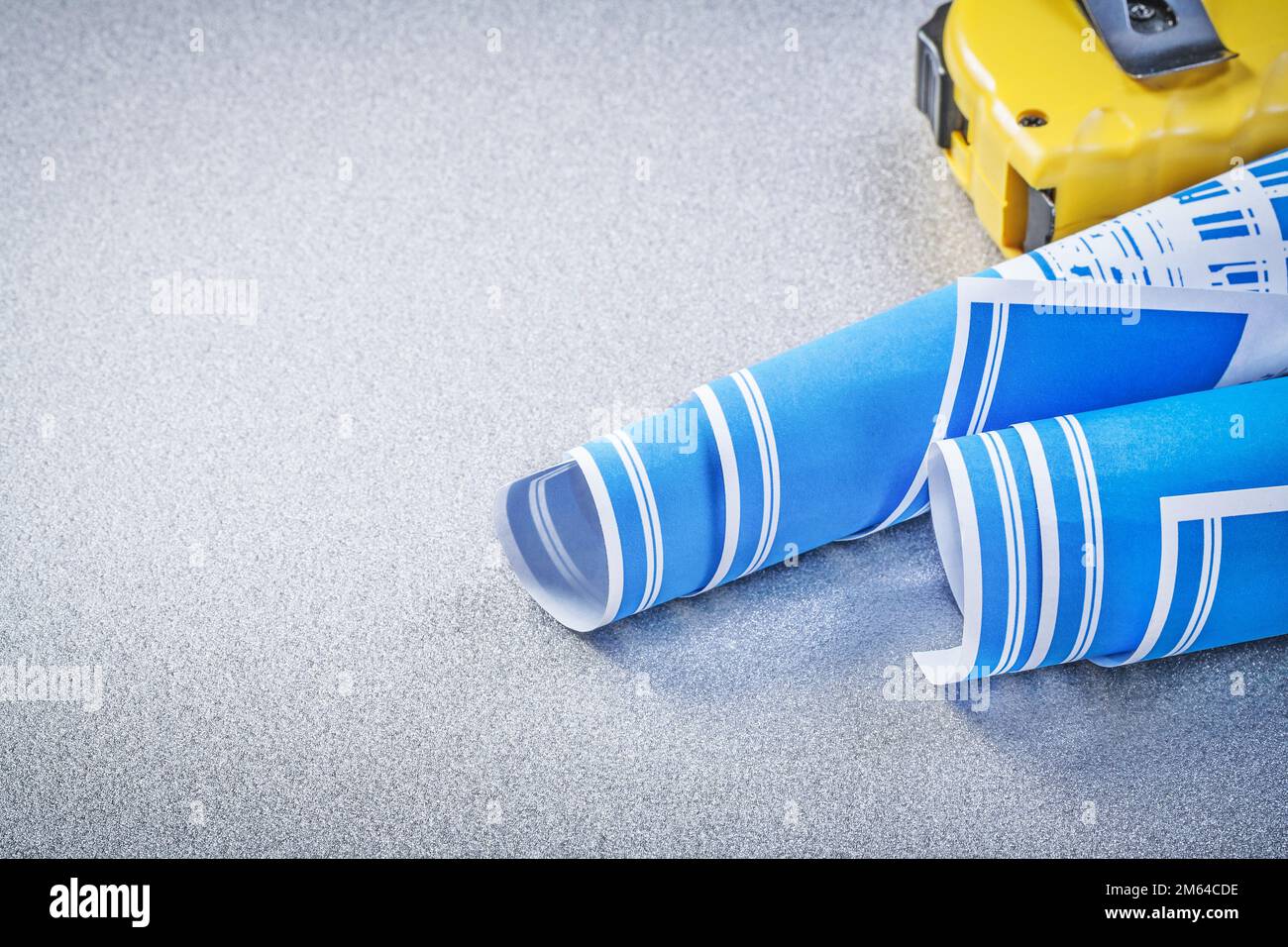 Tape-measure blue engineering drawings on grey background construction ...
