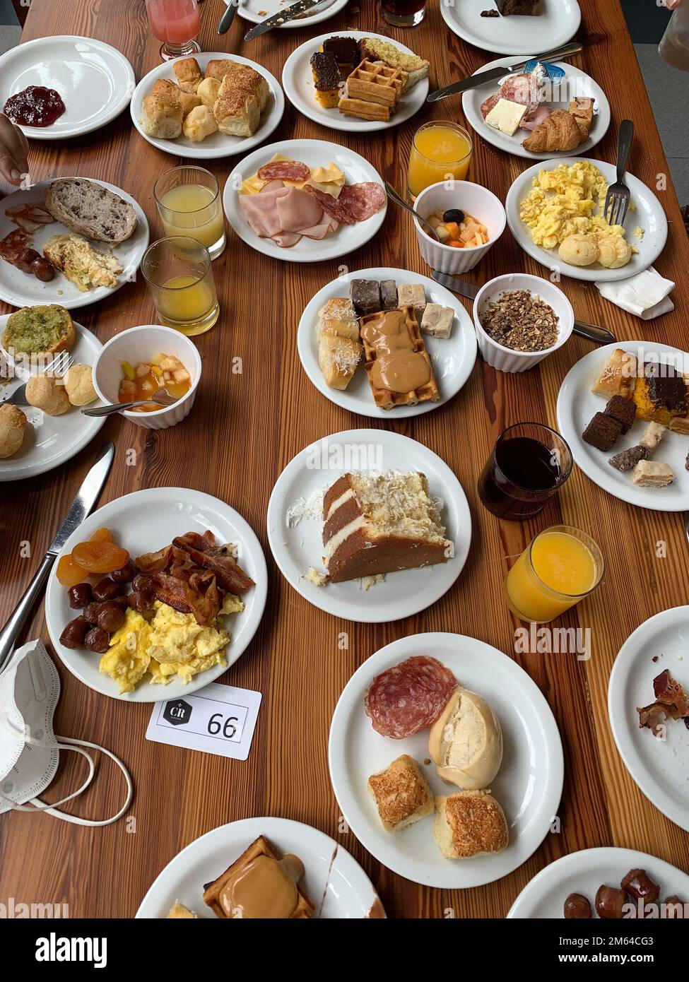 Table filled with plates of food for breakfast Stock Photo - Alamy