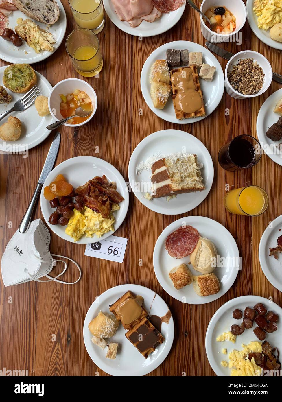 Table filled with plates of food for breakfast Stock Photo - Alamy