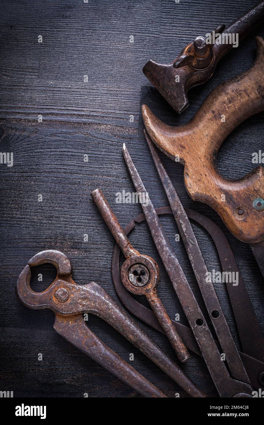 vintage rusted tools on dark board Stock Photo - Alamy
