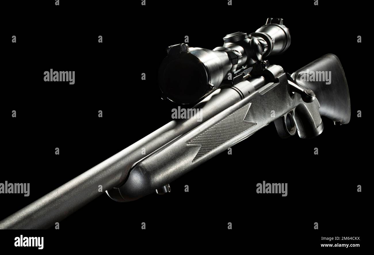 High powered bolt action rifle and scope on a black background Stock ...