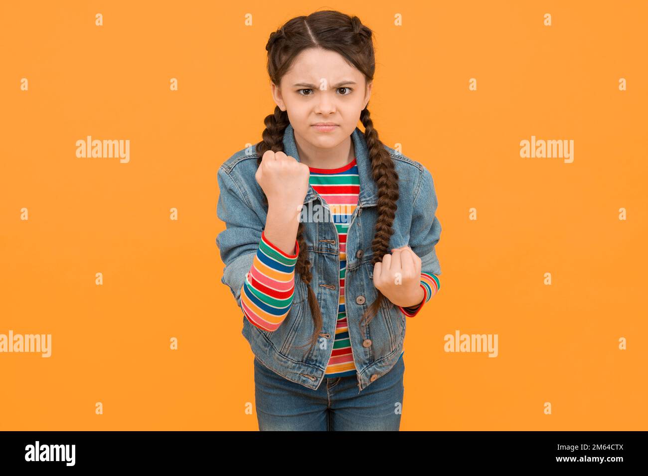 Little girl denim clothes threatening physical aggression, emotional ...