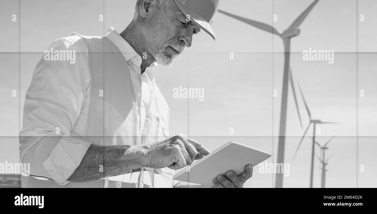 Electrical engineer using digital tablet for wind turbine inspection ...