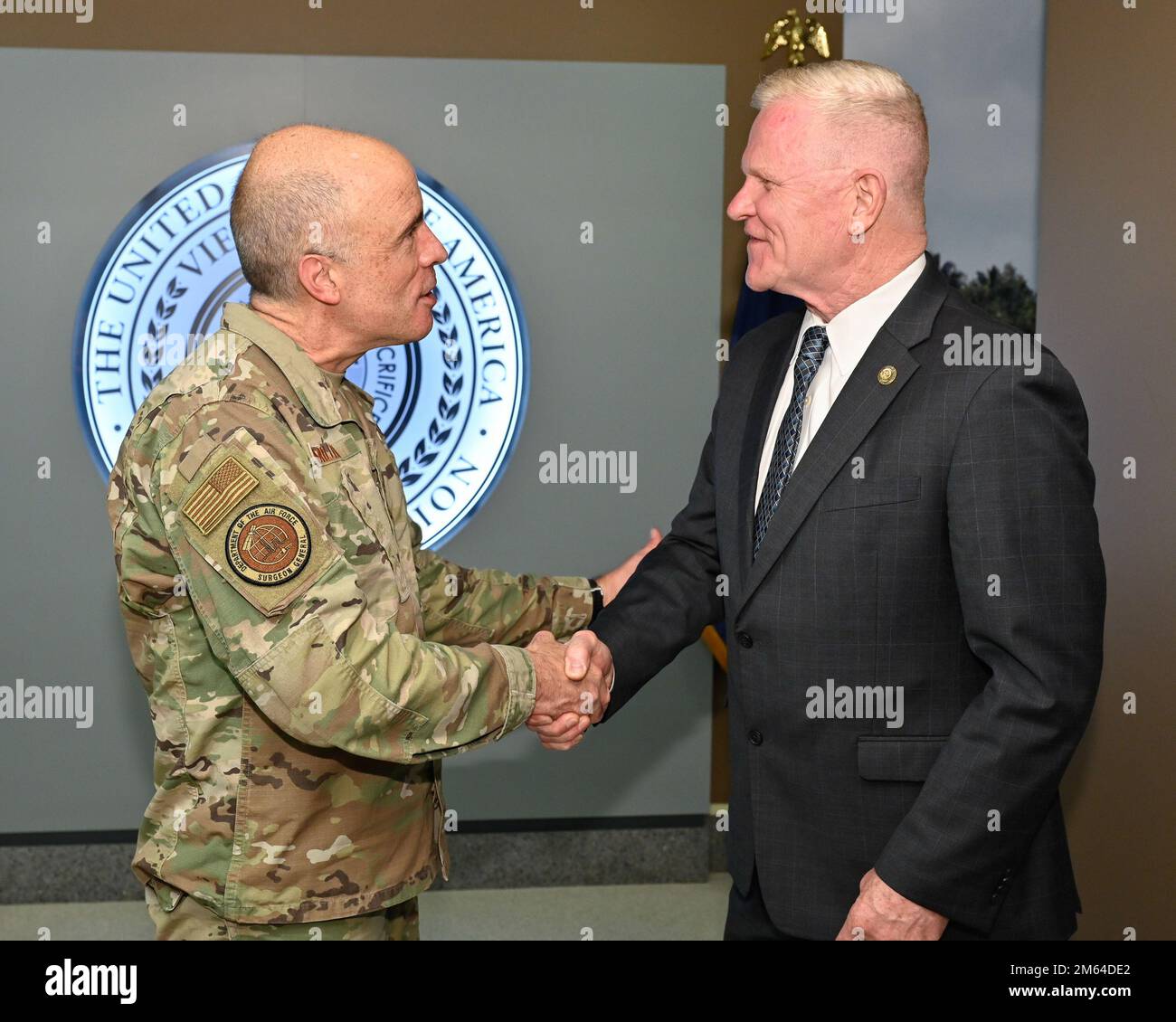 Lt. Gen. Robert Miller, the Air Force surgeon general, presents a coin ...