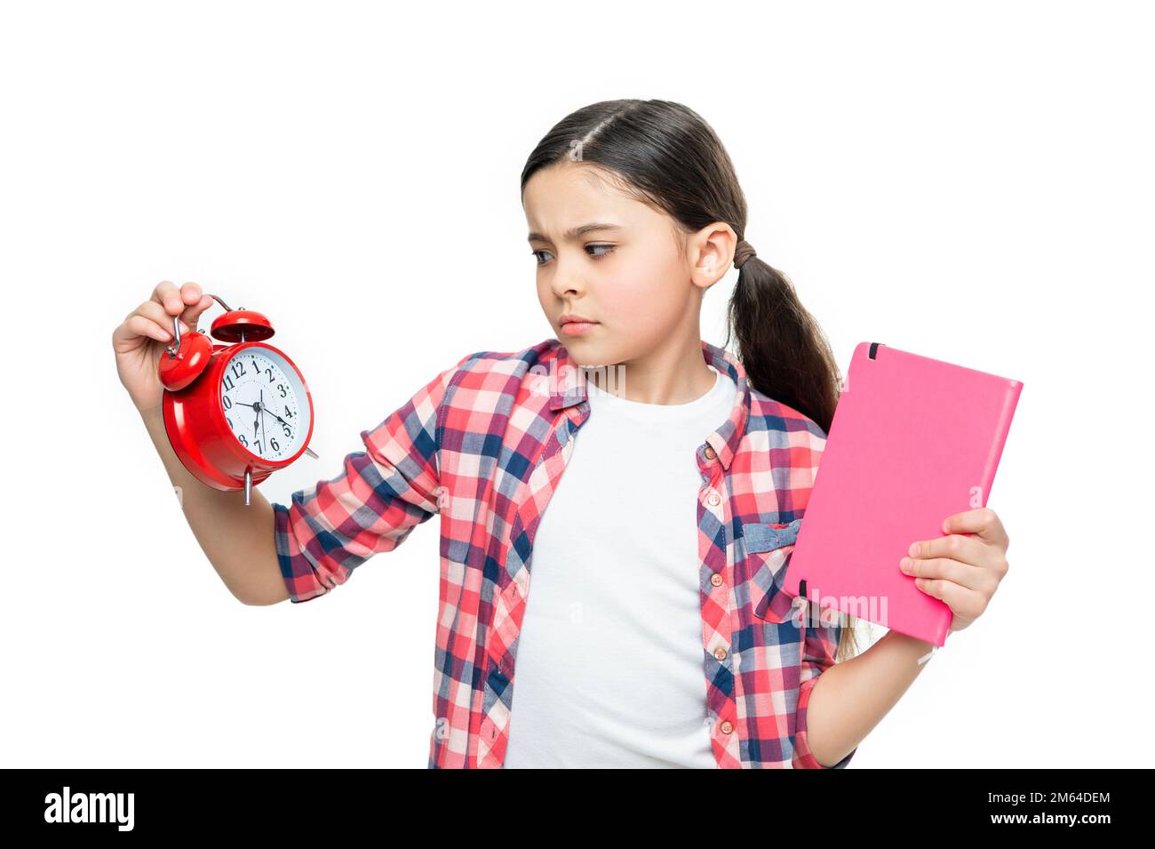 upset school girl with alarm clock in studio. school girl with alarm ...