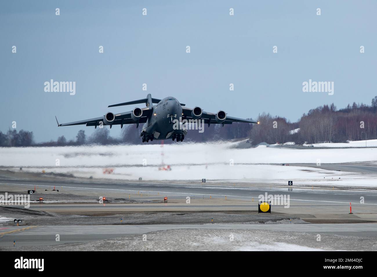 A U.S. Air Force C-17 Globemaster III assigned to the 3rd Wing takes off during Polar Force 22-4 ...