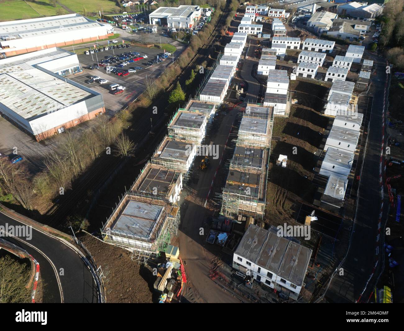 Aerial view of new build modular homes under construction on a former ...
