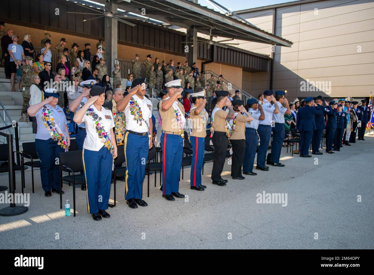 U.S. military Fiesta ambassador’s renders a salute during the national ...