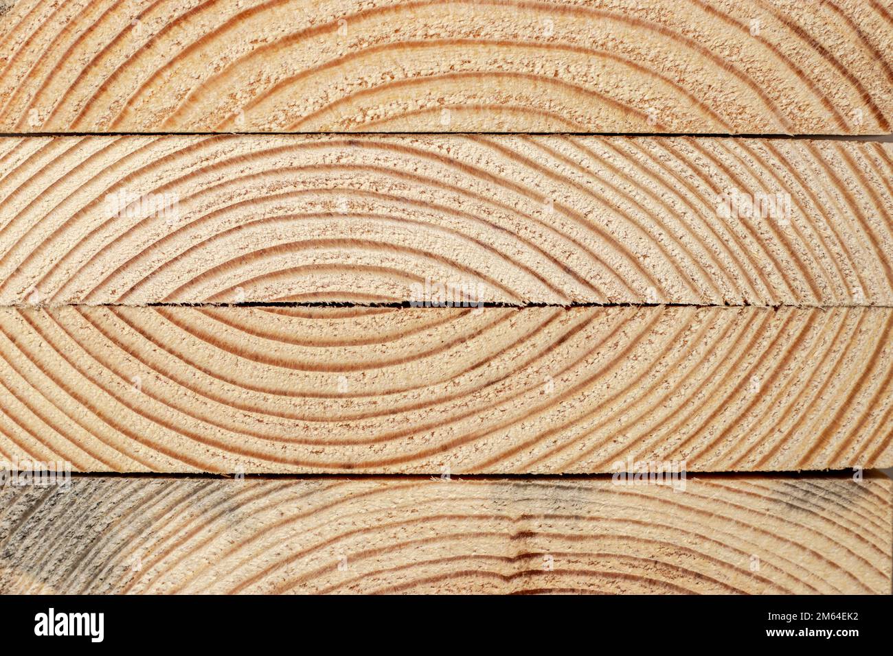Stacks of pine wood planks. Natural rough wooden boards boards, lumber ...